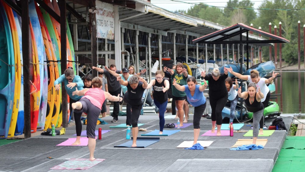 Find Your Balance With Stand-Up Paddleboard Yoga in Oregon - Travel Oregon